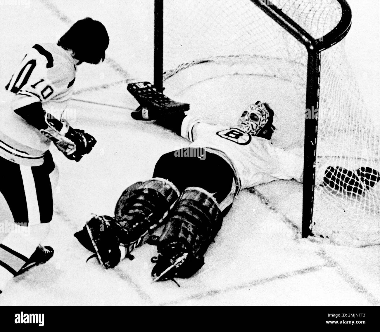 Boston Bruins goalie Jerry Cheevers lies prone in the net as he made a ...