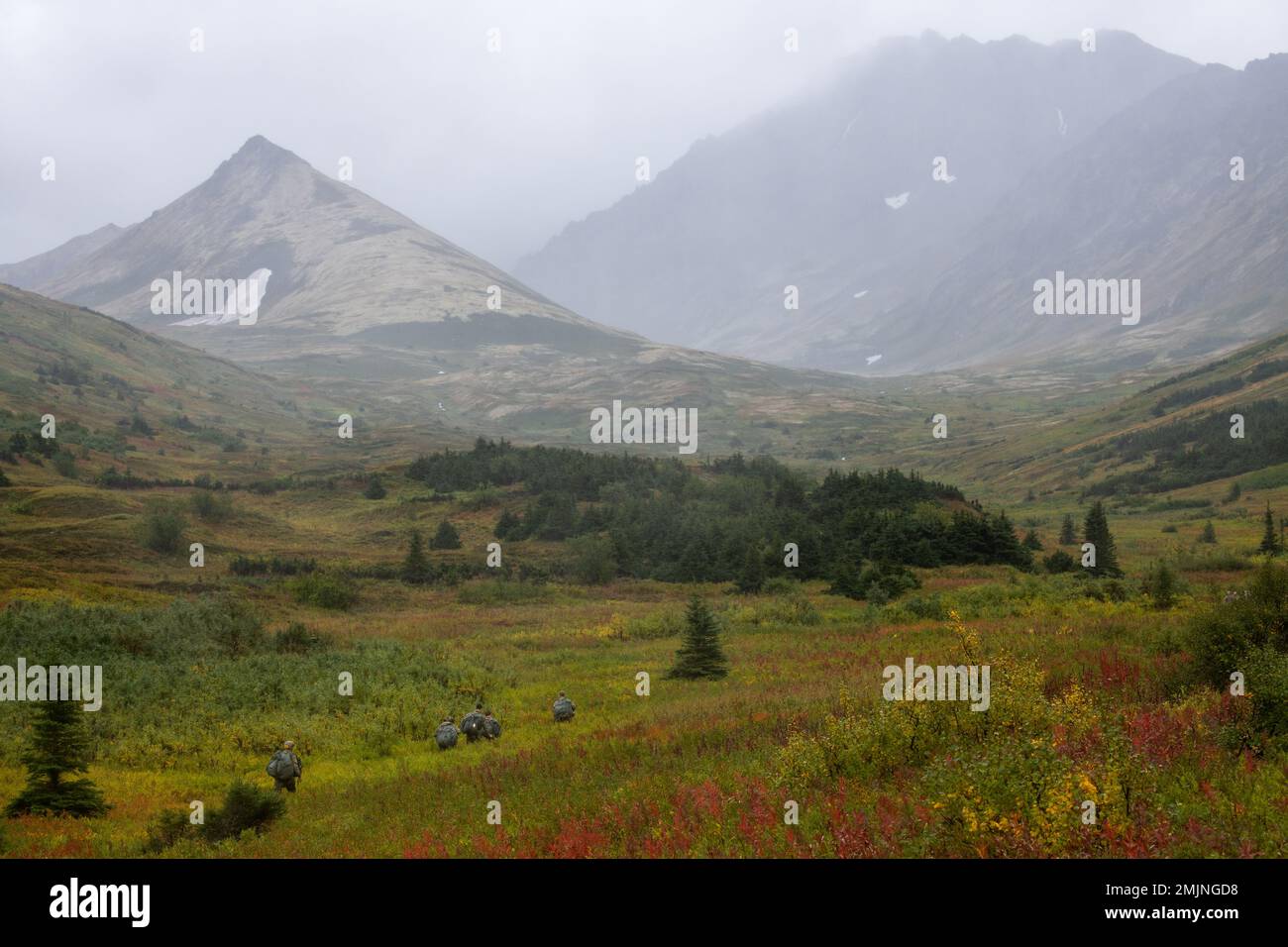 Airmen make their way to the rally point after airborne operations at ...