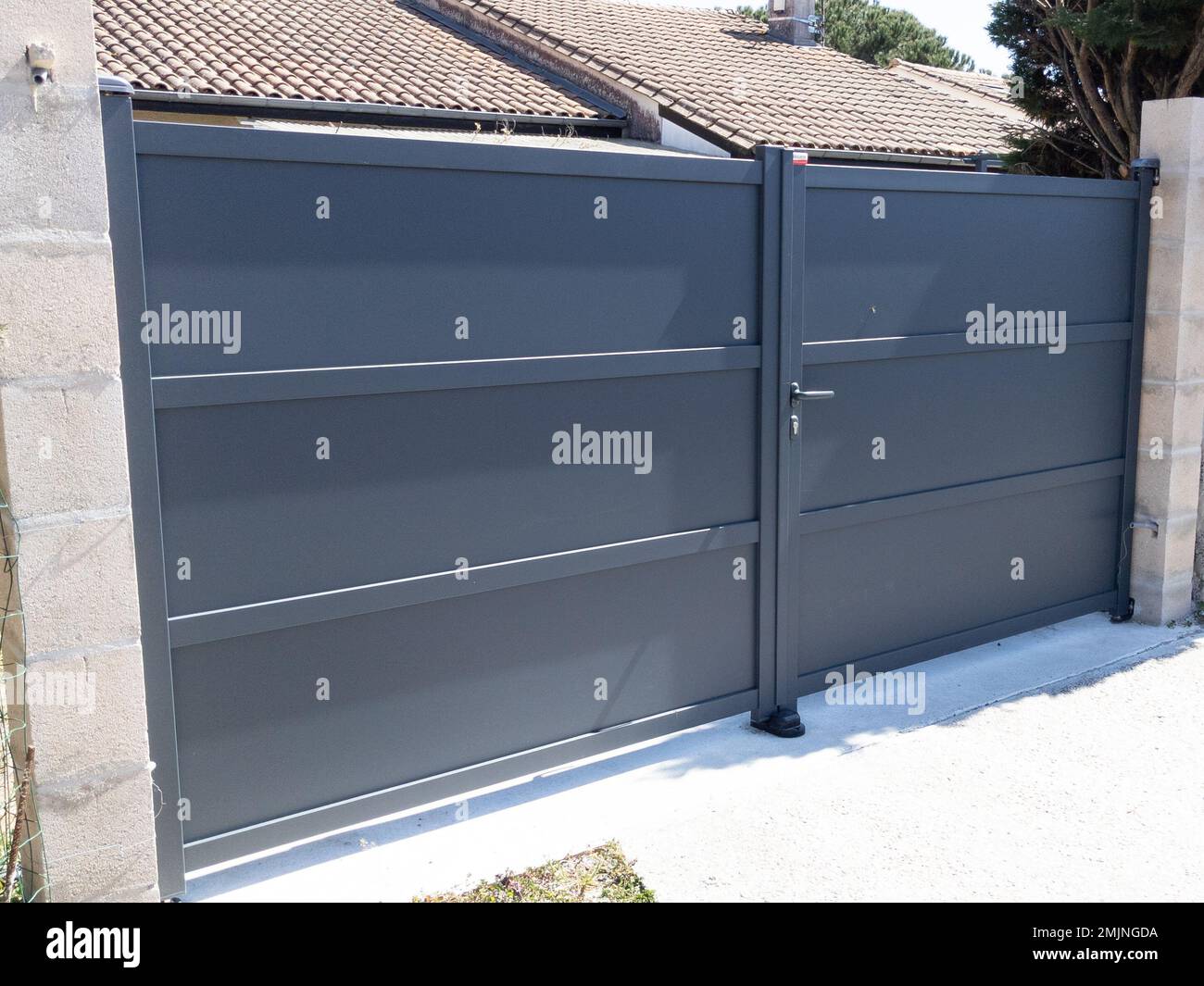 Aluminium door modern home gray steel gate portal of suburb house Stock ...