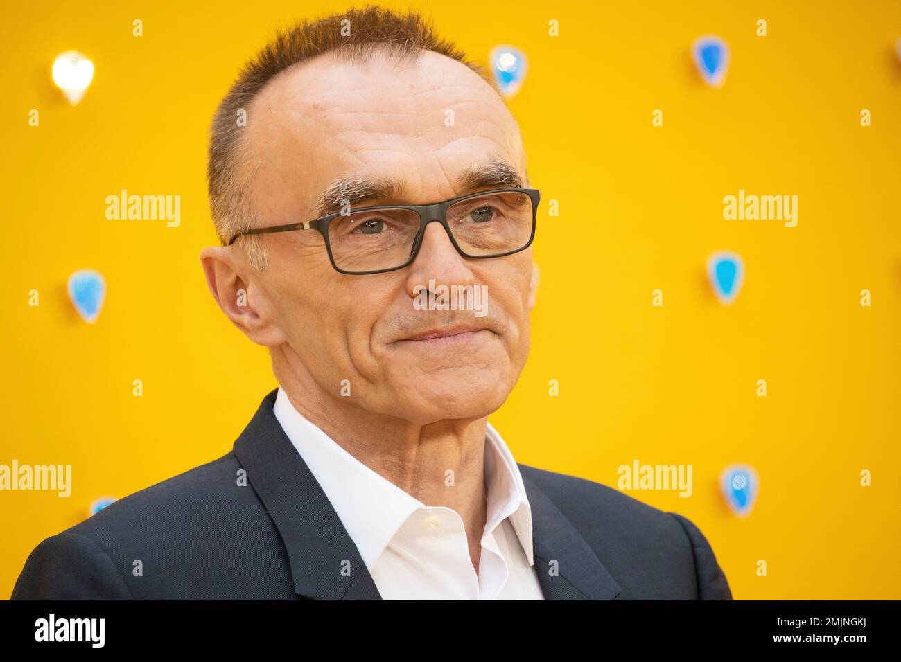Director Danny Boyle poses for photographers upon arrival at the ...