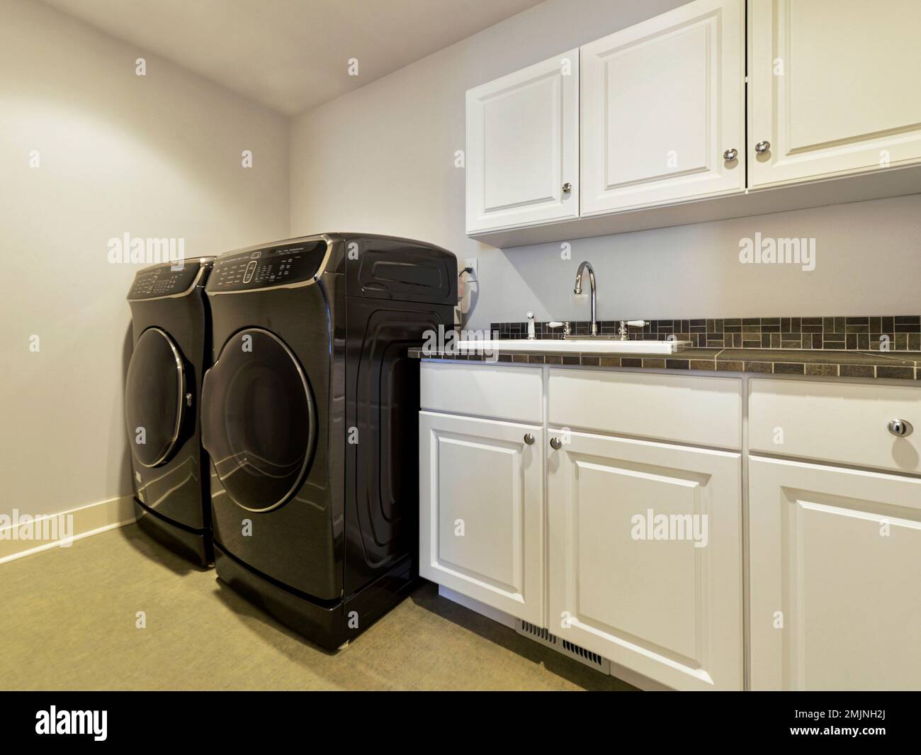 Modern residential laundry room interior Stock Photo - Alamy