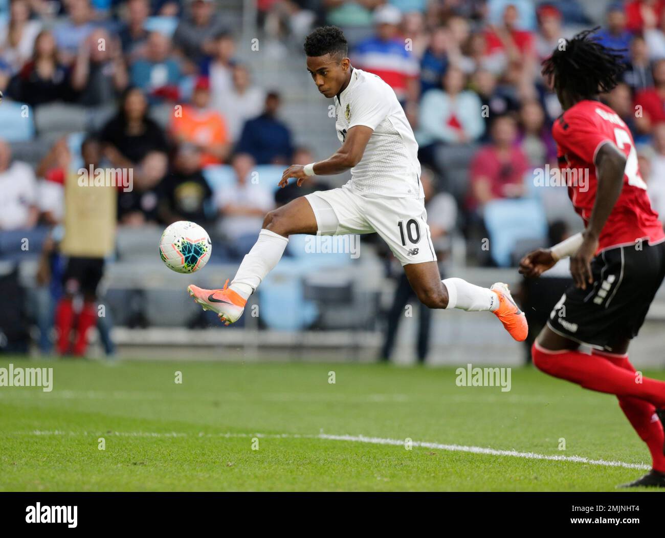 Panama's Edgar Barcenas (10) kicks a goal in front of Trinidad and ...