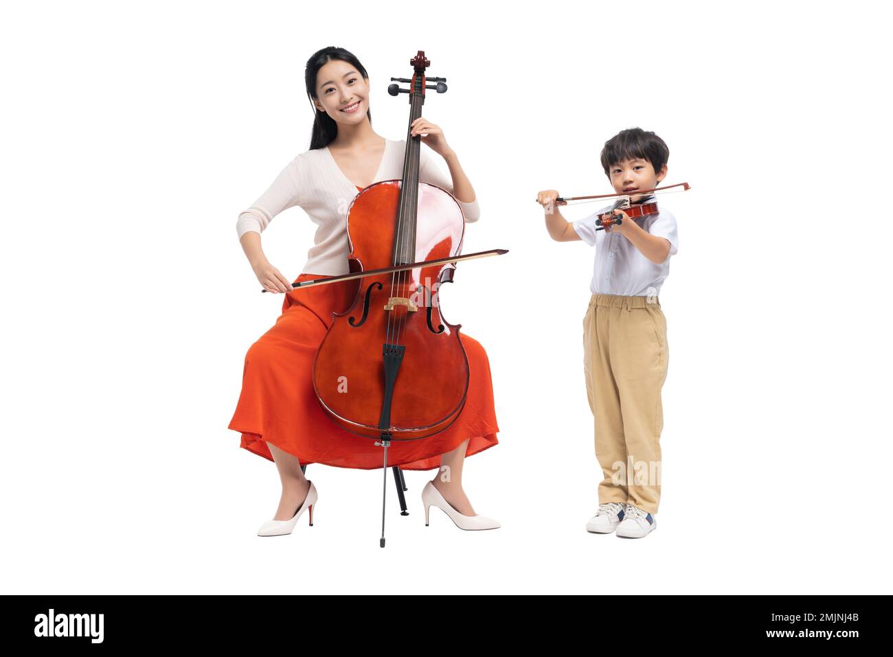 The female teacher guide the boy playing Musical Instruments Stock ...