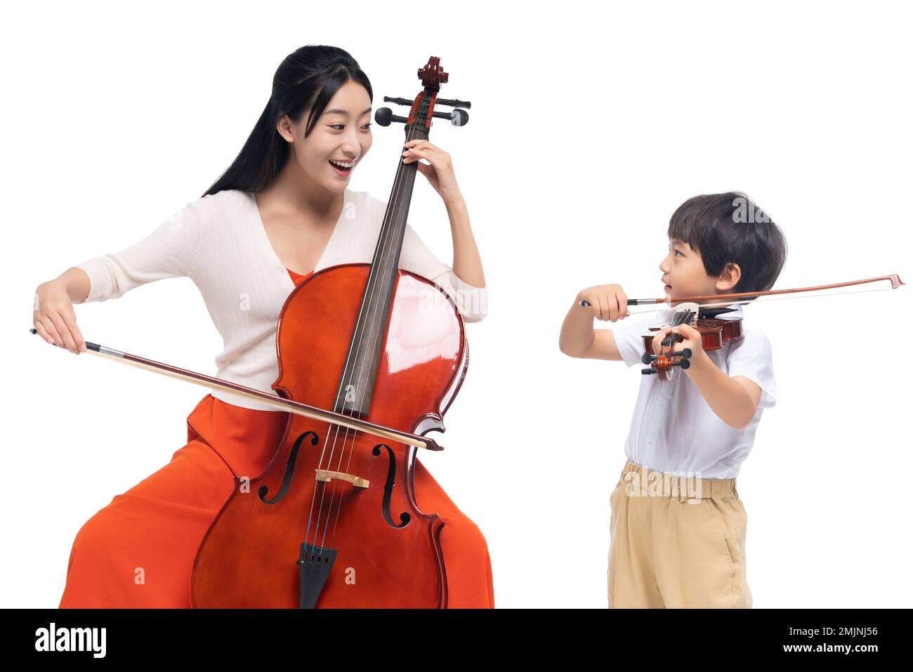 The female teacher guide the boy playing Musical Instruments Stock ...