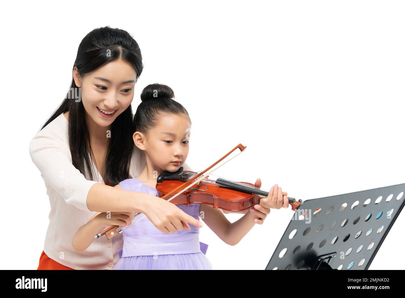 The female teacher guide girl playing Musical Instruments Stock Photo ...
