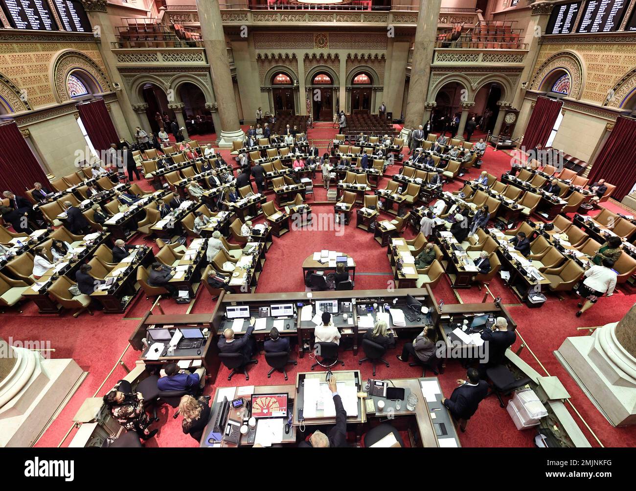 New York state Assembly members work on passing legislation in the ...