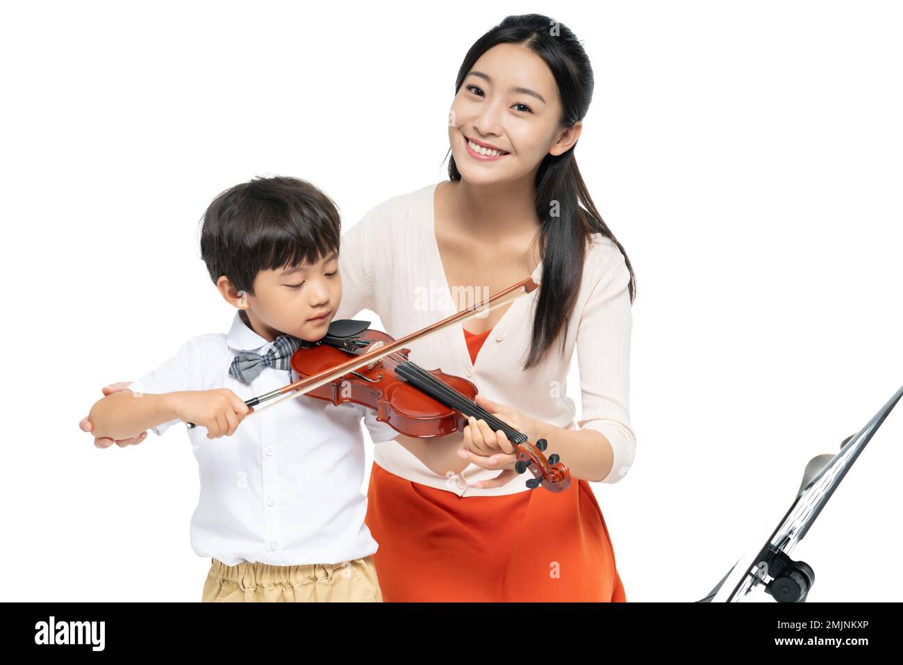 School age children playing instruments hi-res stock photography and ...