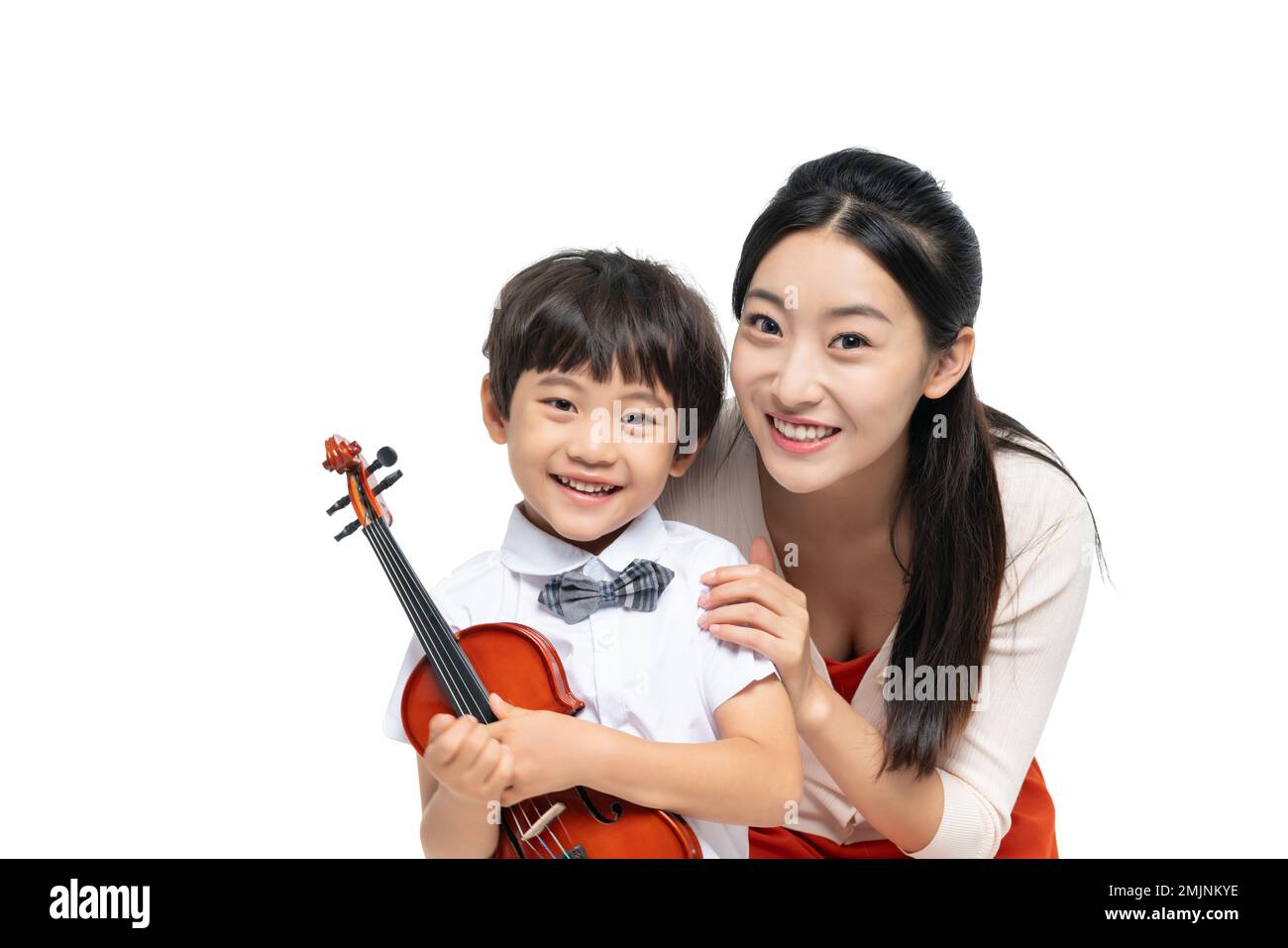 The female teacher guide the boy playing Musical Instruments Stock ...