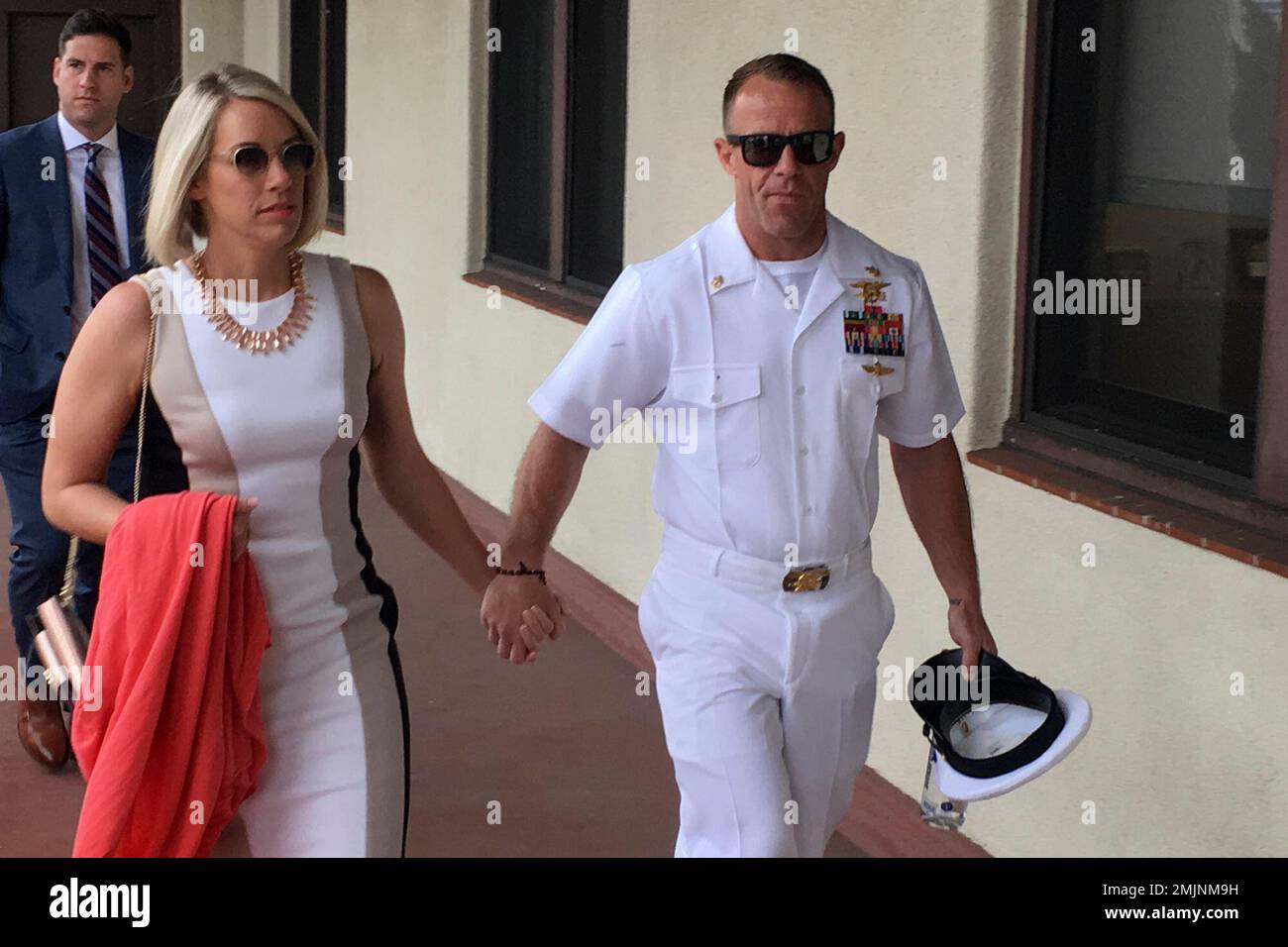 Navy Special Operations Chief Edward Gallagher, right, walks with his ...