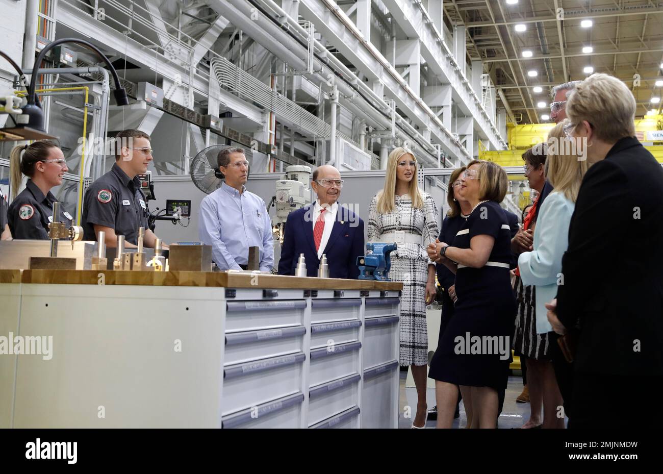 Senior White House adviser Ivanka Trump, center right, and Commerce ...