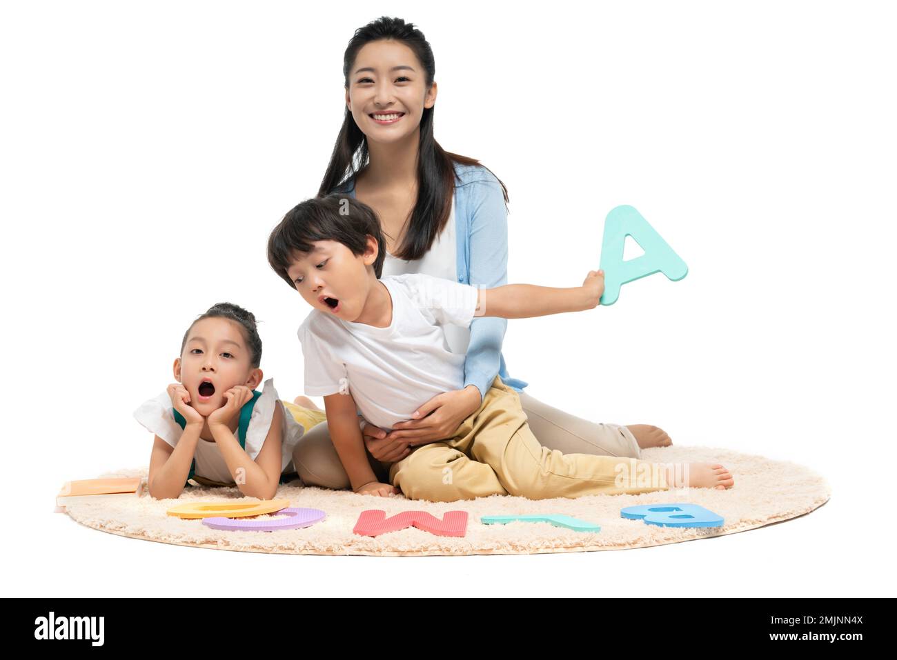 A young female teacher counseling students learning Stock Photo - Alamy