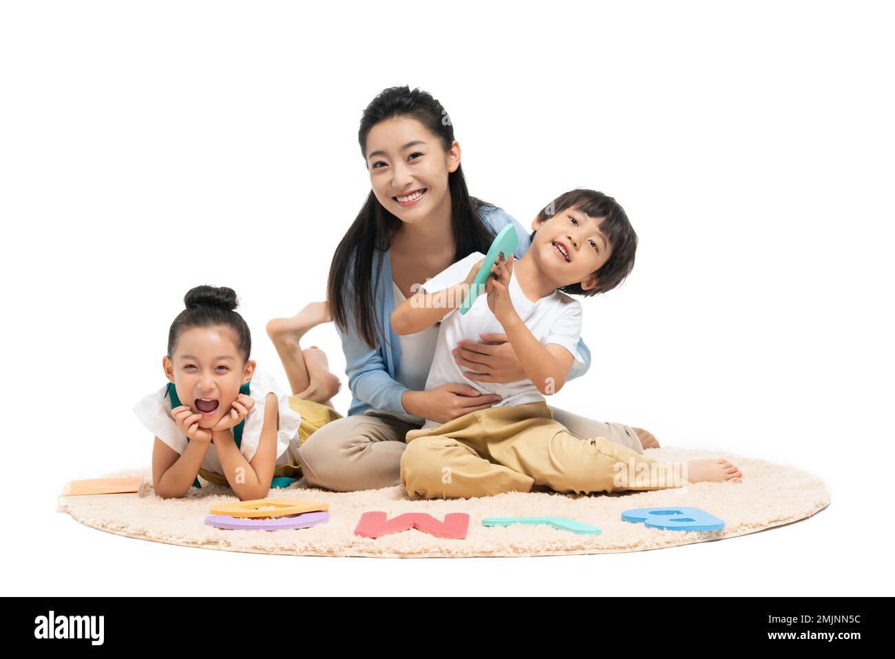 A young female teacher counseling students learning Stock Photo - Alamy