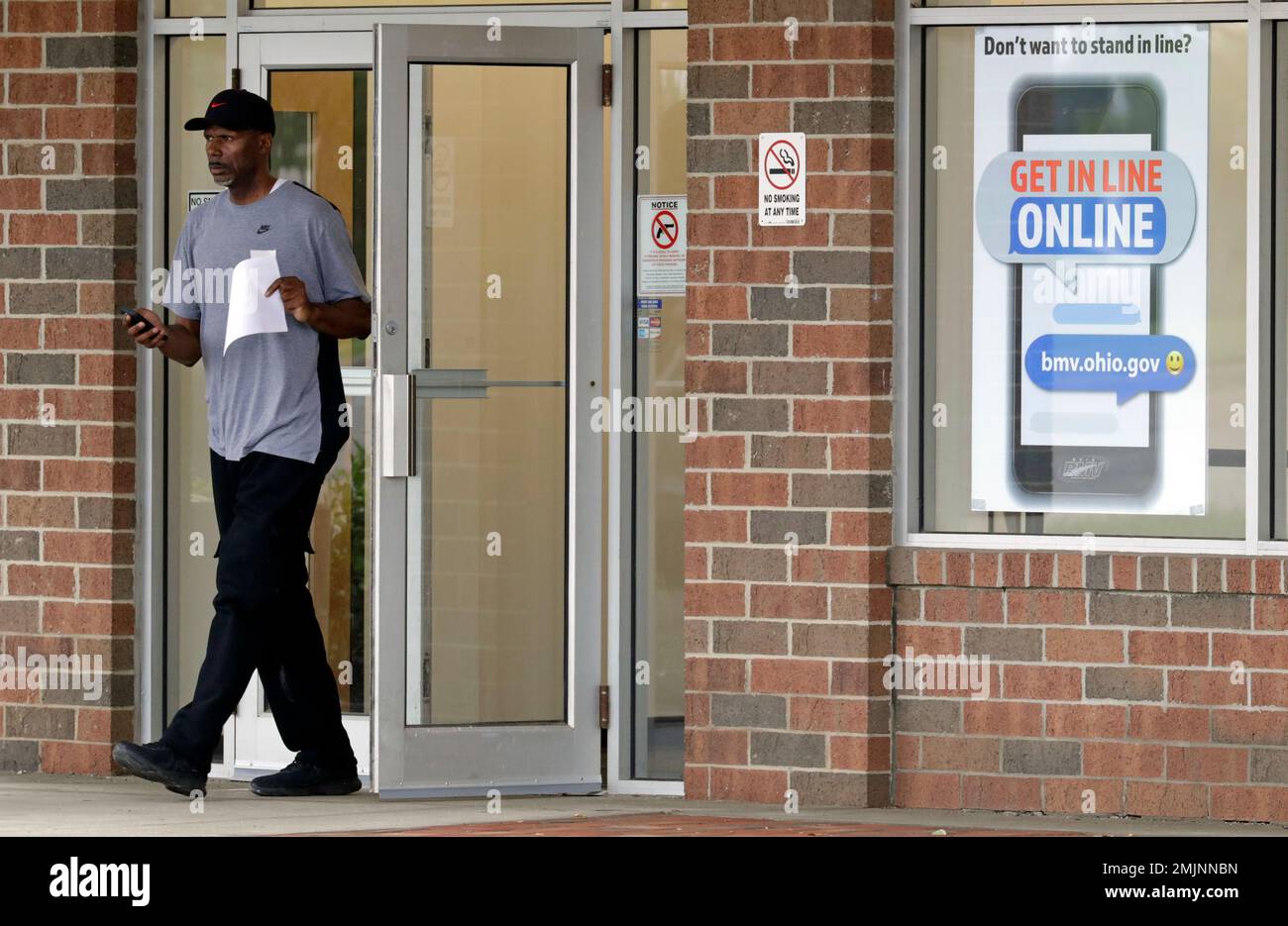 Darryl Franklin walks out of the Bureau of Motor Vehicles office ...