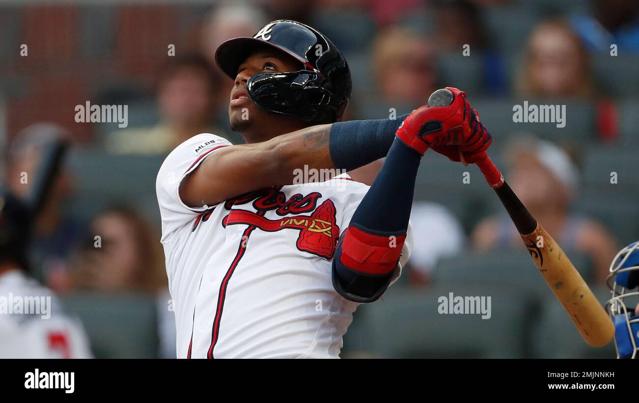 Atlanta Braves left fielder Ronald Acuna Jr. (13) follows through on a ...
