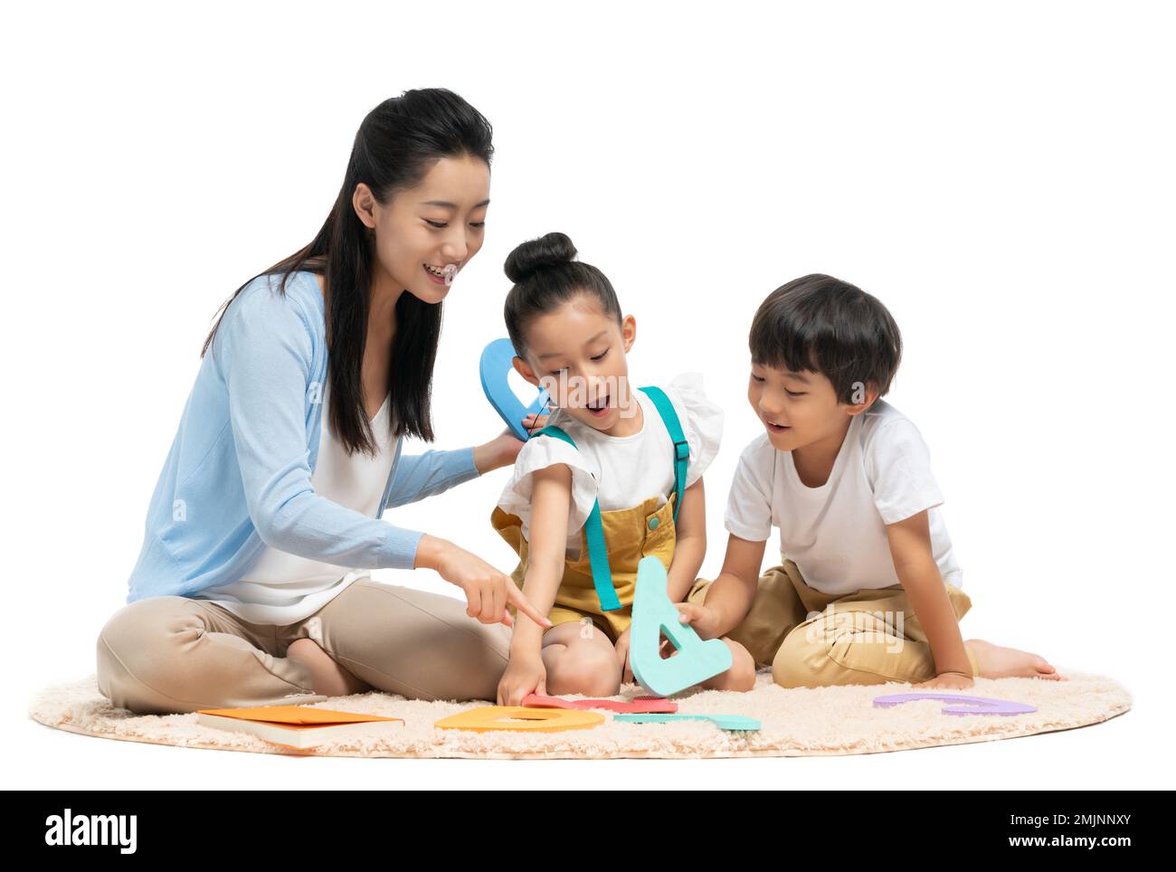 A young female teacher counseling students learning Stock Photo - Alamy