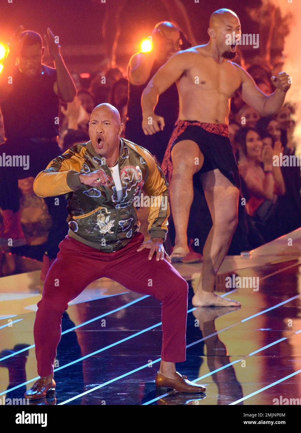 Dwayne Johnson, also known as The Rock, in foreground, dances before he ...
