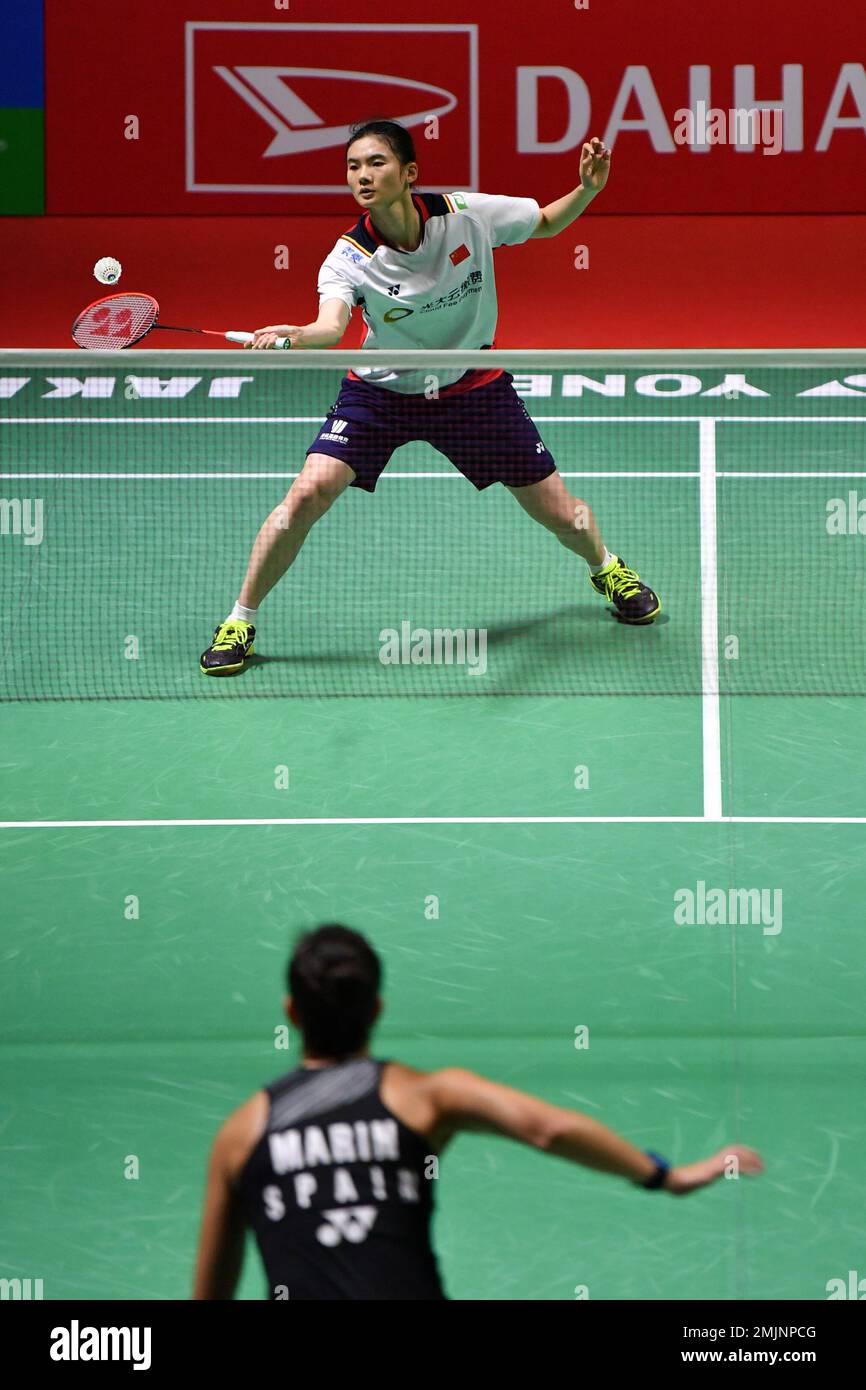 Jakarta, Indonesia. 28th Jan, 2023. Han Yue (top) of China hits a ...