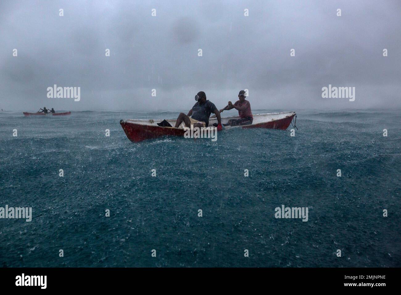 Miskito fishermen fish for sea cucumbers in heavy rain near Savannah ...