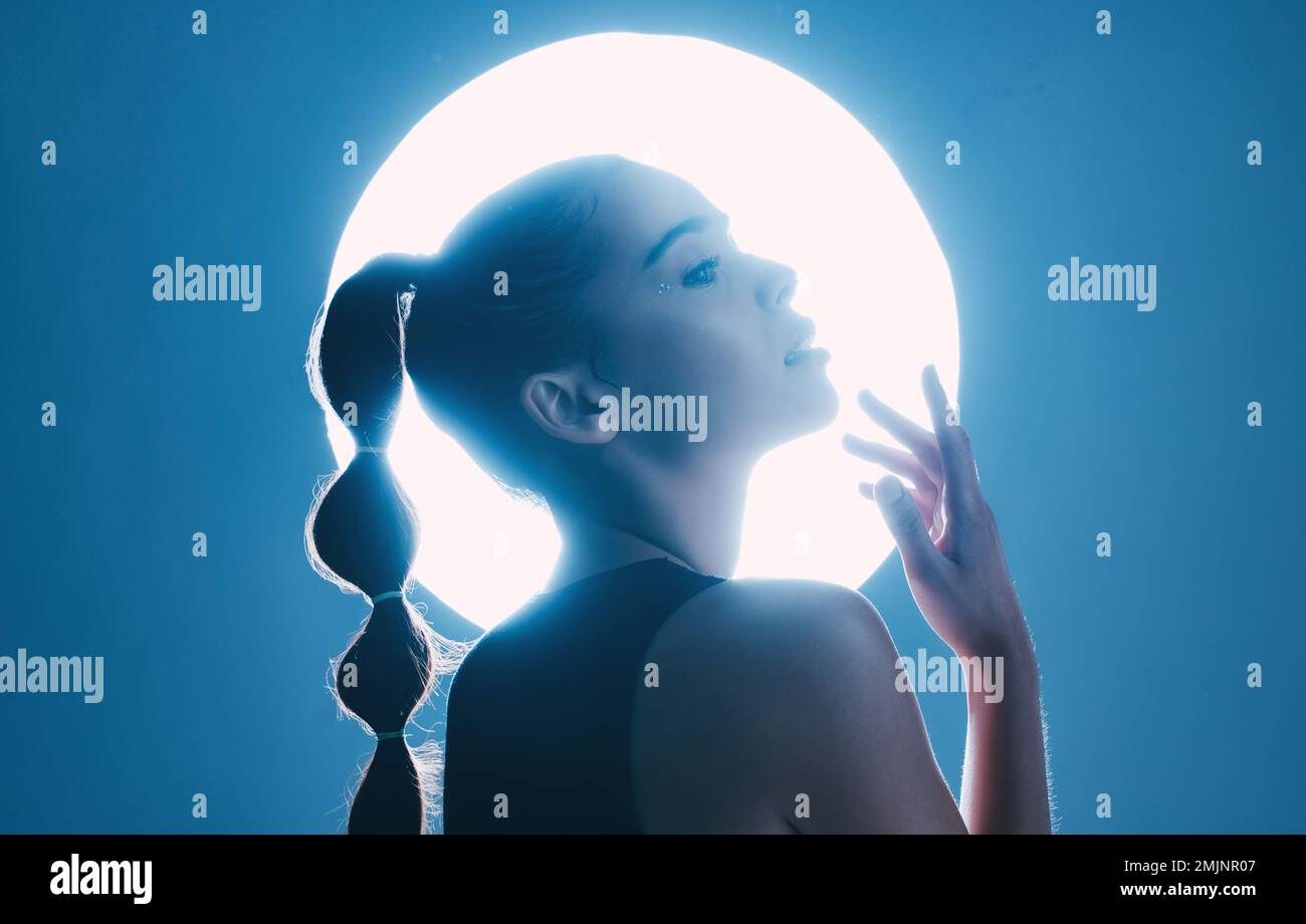 Magical, beautiful and face of a girl with lighting isolated on a dark ...
