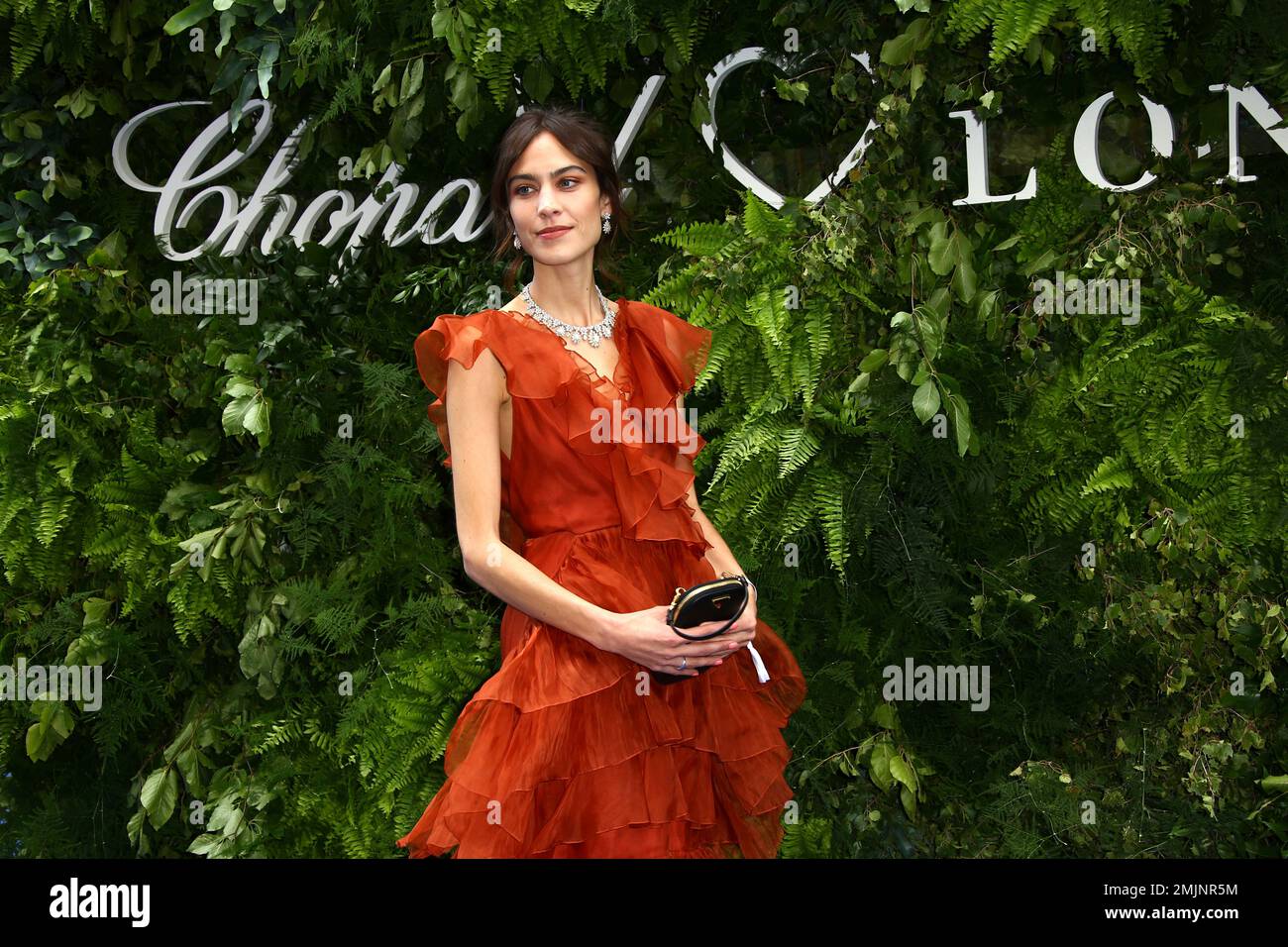 Model Alexa Chung poses for photographers upon arrival at the Chopard ...