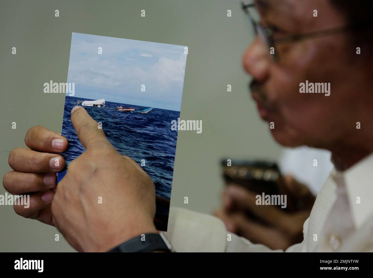 Department of Agriculture Secretary Emmanuel Pinol shows a June 10 ...