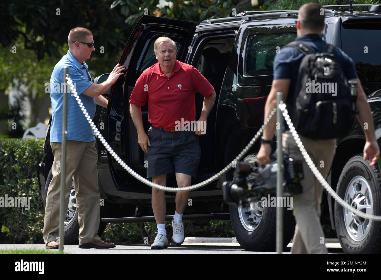 Sen. Lindsey Graham, R-S.C., gets out of the car at the White House in ...