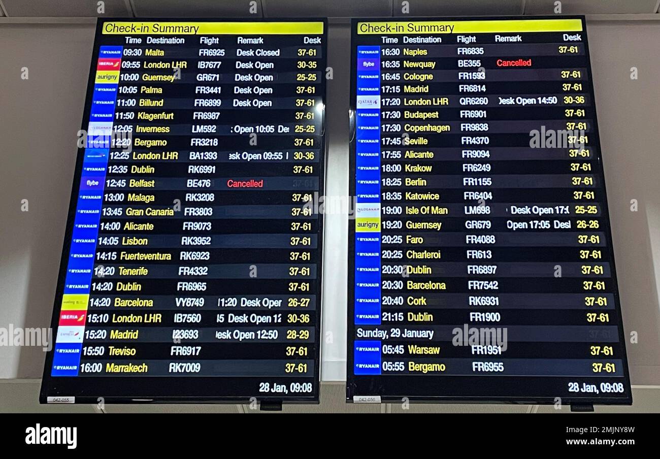 The departure boards at Manchester Airport showing two cancelled Flybe ...