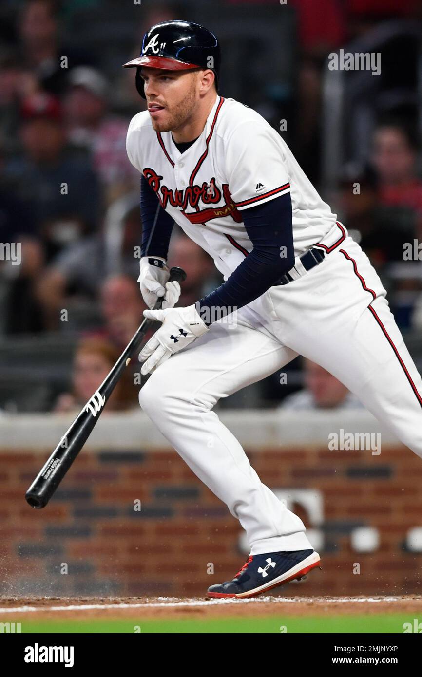 Atlanta Braves' Freddie Freeman bats in an RBI during a baseball game ...