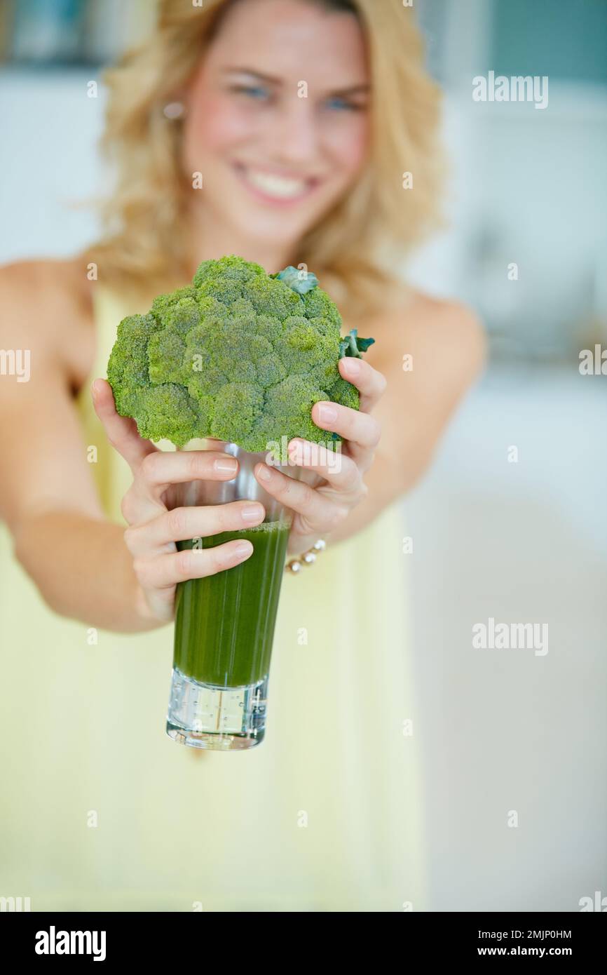 Staying healthy is as easy as one, two, broccoli. Portrait of a happy ...