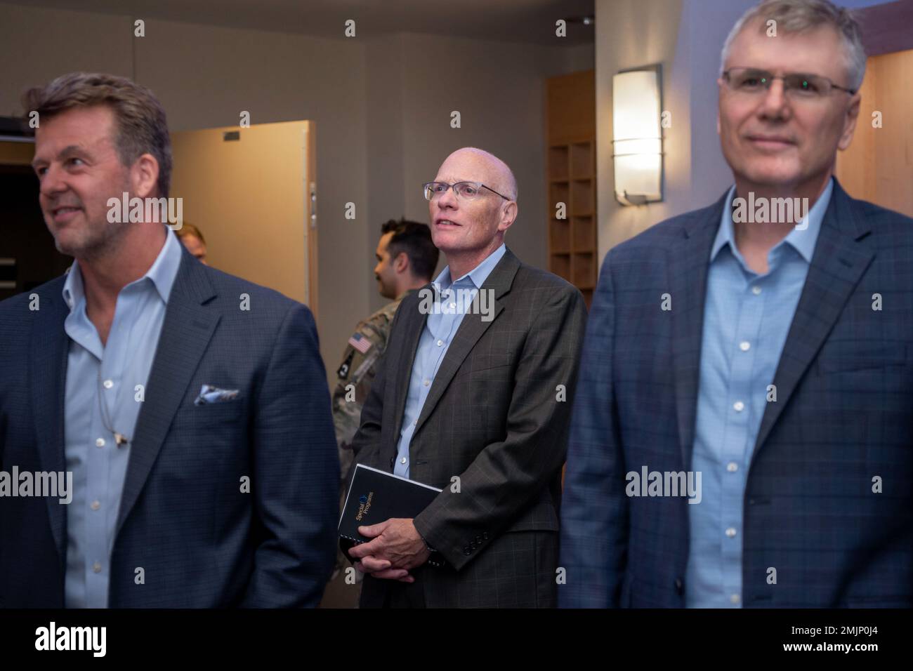George C. Barnes, center, deputy director and senior civilian leader of ...