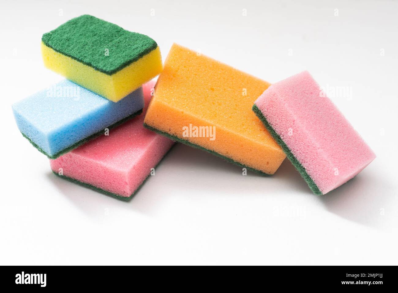 Multi-colored sponges for dishes Isolated on a white background Stock ...