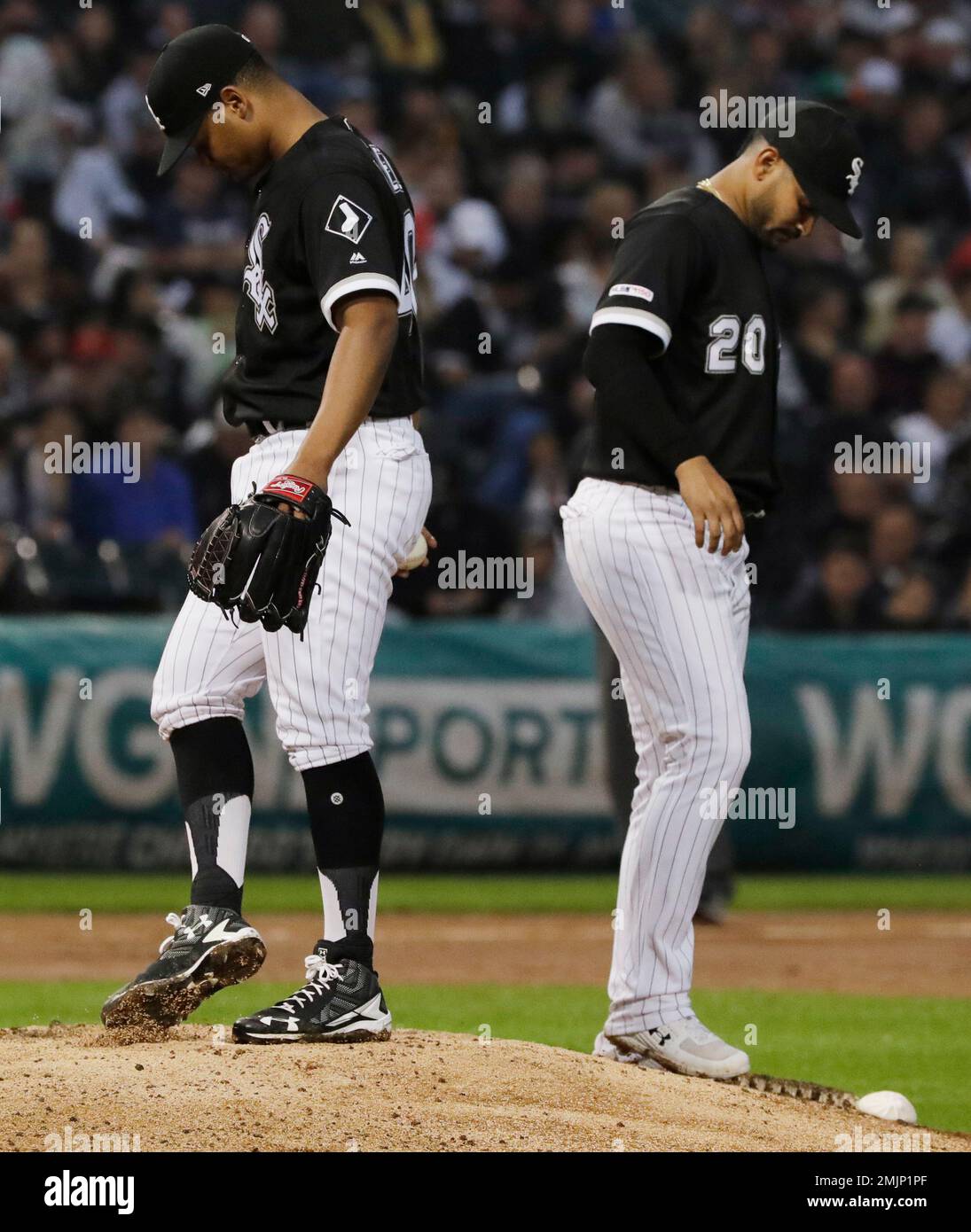 Chicago White Sox starting pitcher Reynaldo Lopez, left, and third ...