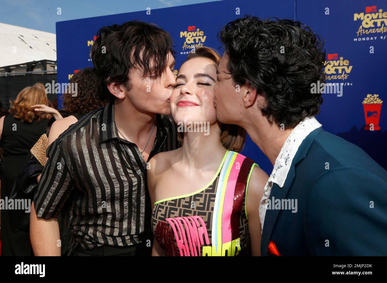 Ross Lynch, left, and Gavin Leatherwood, right, kiss Kiernan Shipka as ...