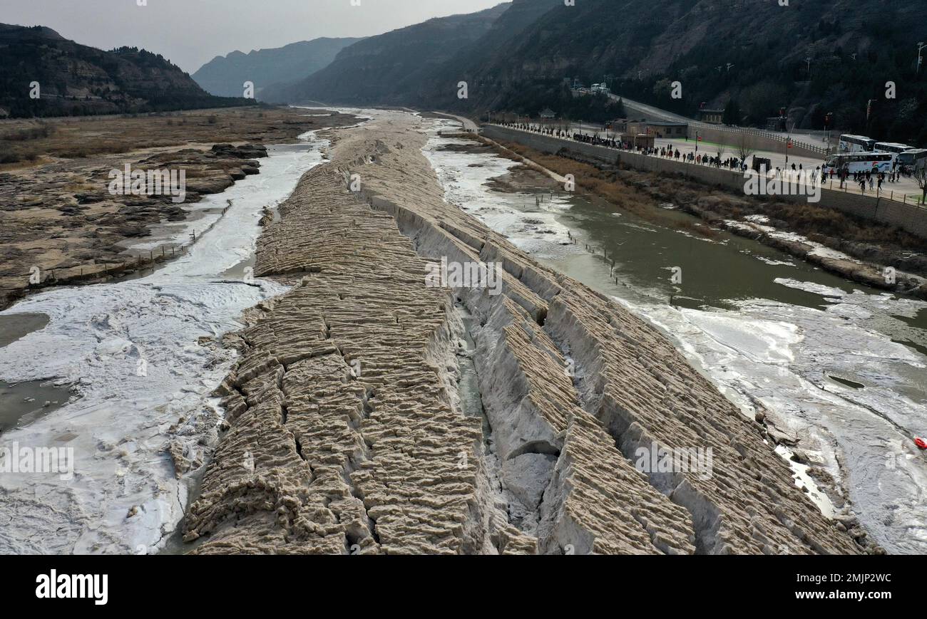 Aerial photo shows the Hukou Waterfall covered by ices in Ji County ...