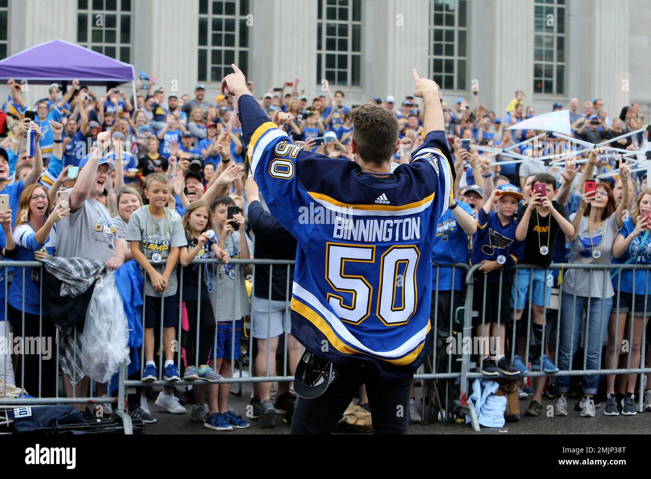 St. Louis Blues goaltender Jordan Binnington celebrates with fans ...