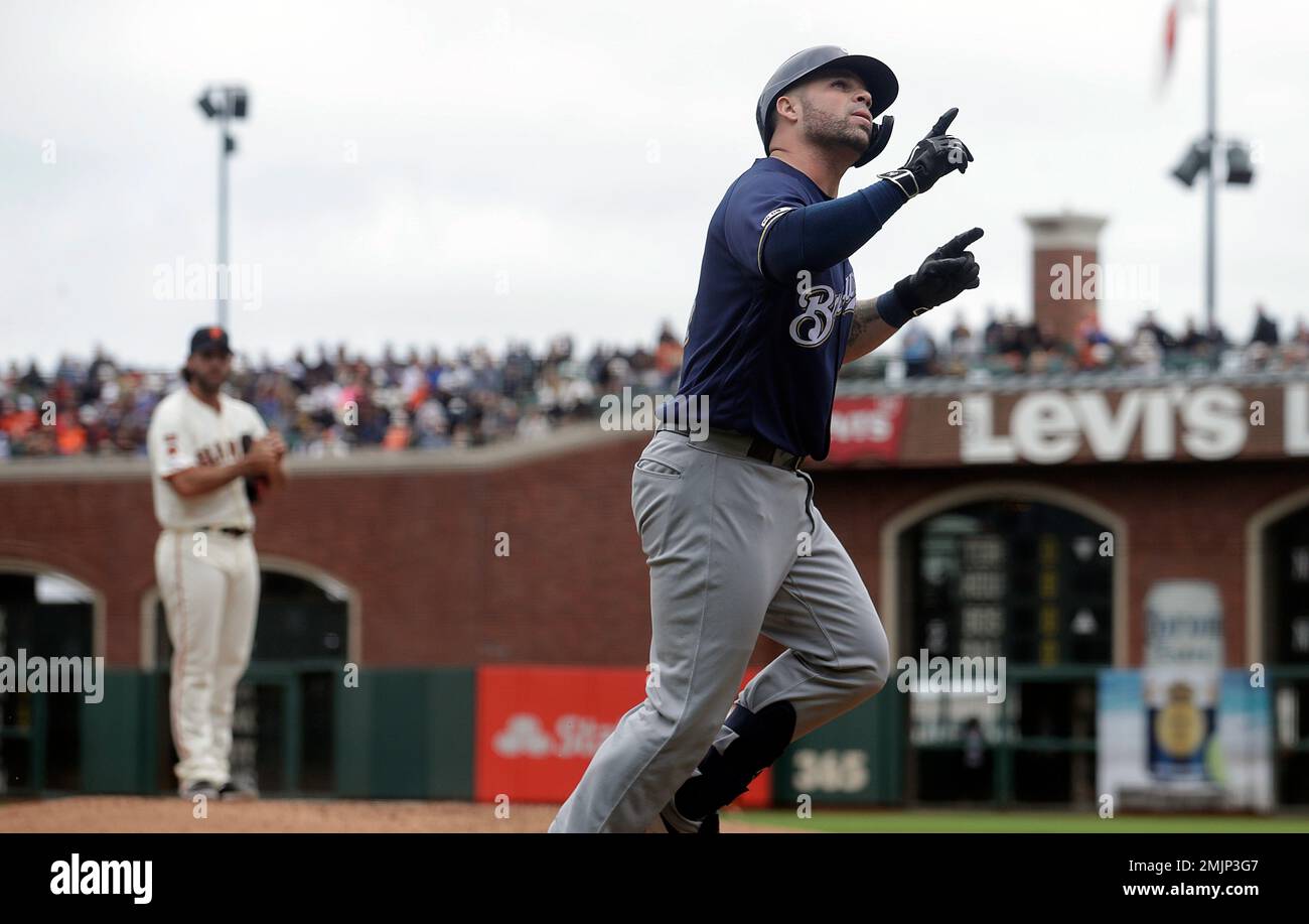 Milwaukee Brewers' Manny Pina, right, gestures after hitting a solo ...