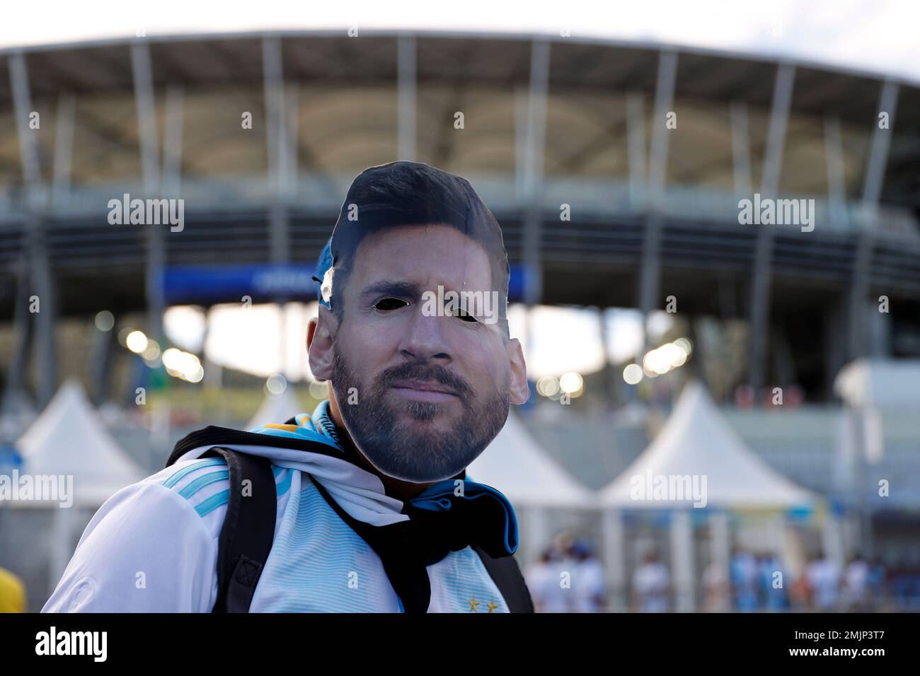 A fan of Argentina wears a mask of Lionel Messi outside Arena Fonte ...