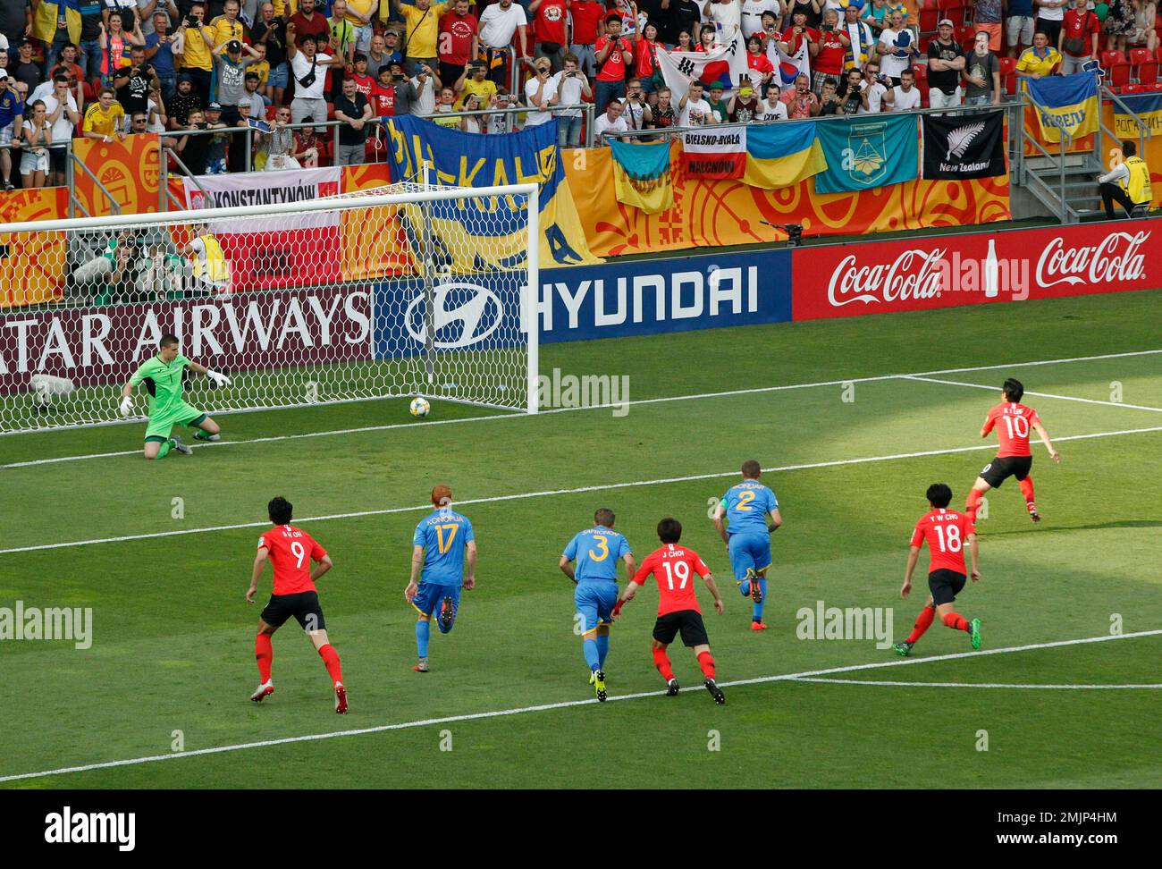 South Korea's Lee Kang-in, right, scores his side's opening goal on a ...