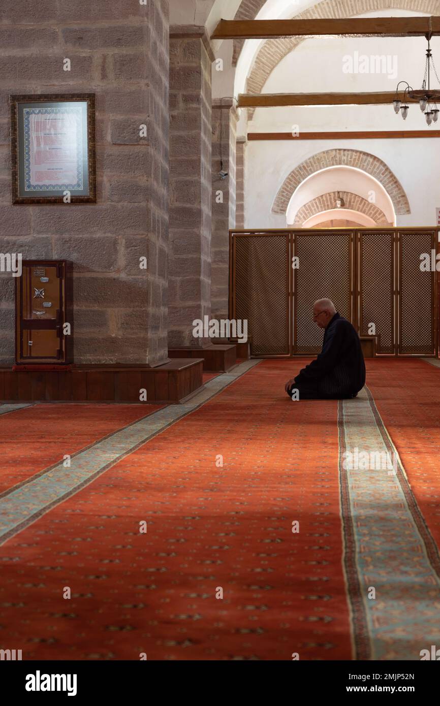 Ramadan or islamic photo. An elder muslim man praying in the mosque ...