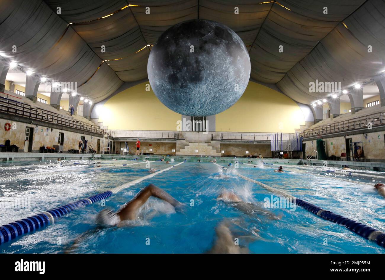 Swimmers practice as the installation 'Museum of the Moon', a seven ...