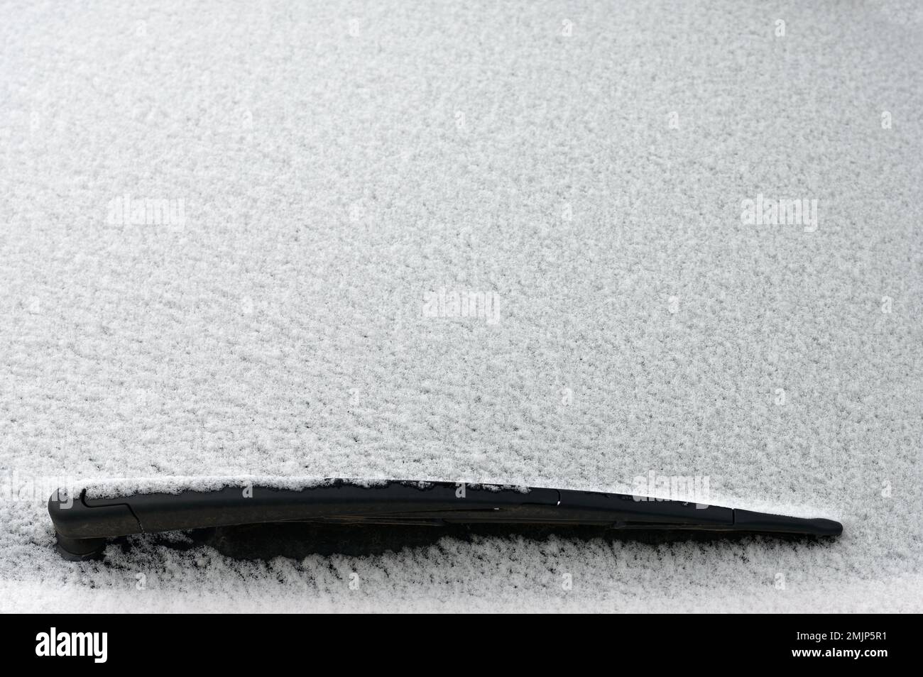 Snowy windshield on a car with wipers. Winter concept for traffic and ...