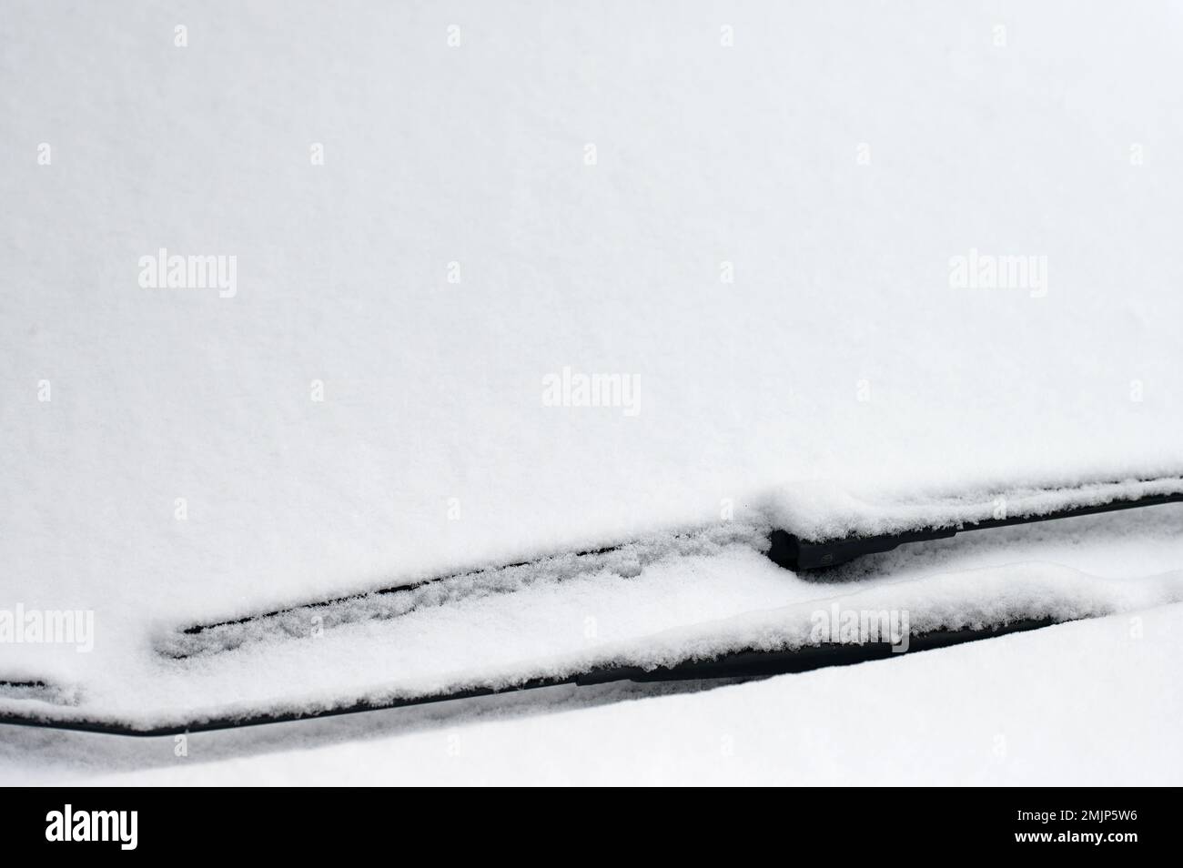 Snowy windshield on a car with wipers. Winter concept for traffic and ...