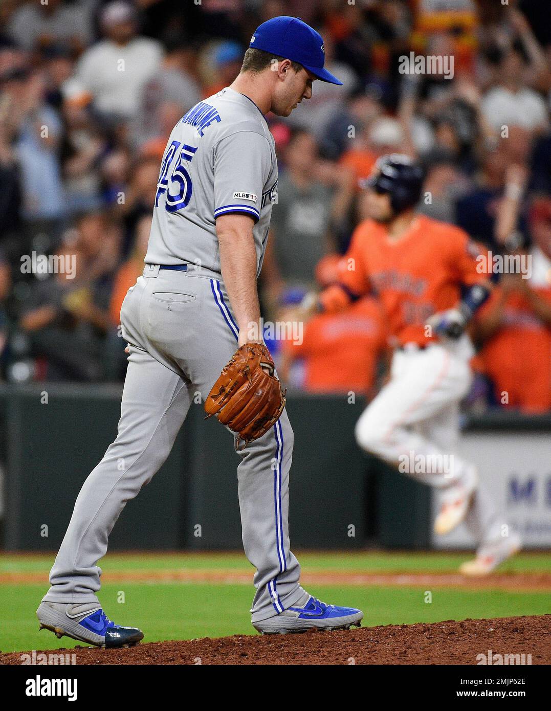 Toronto Blue Jays relief pitcher Thomas Pannone, left, walks back to ...