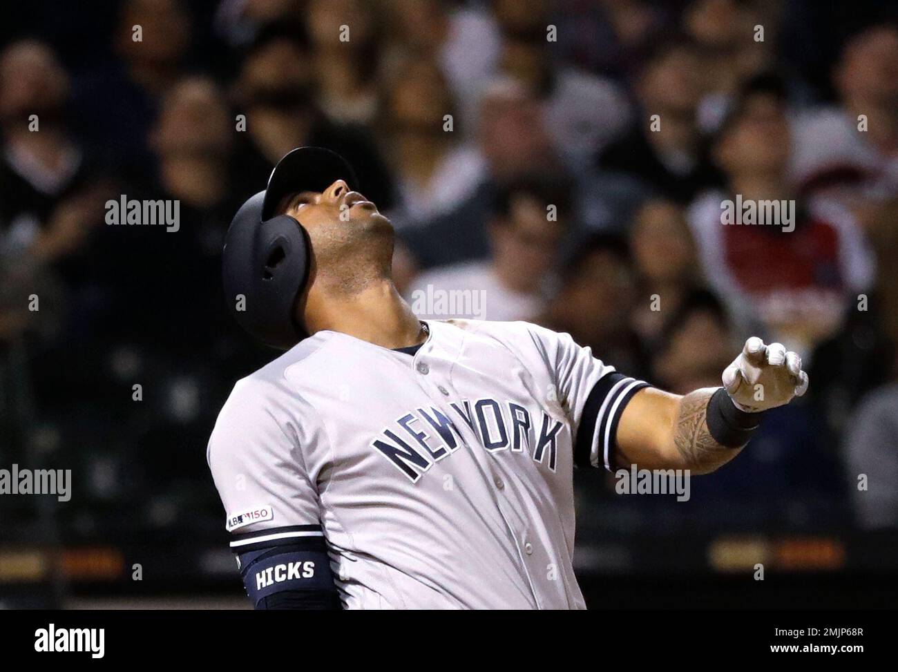 New York Yankees' Aaron Hicks looks up after hitting a foul ball ...