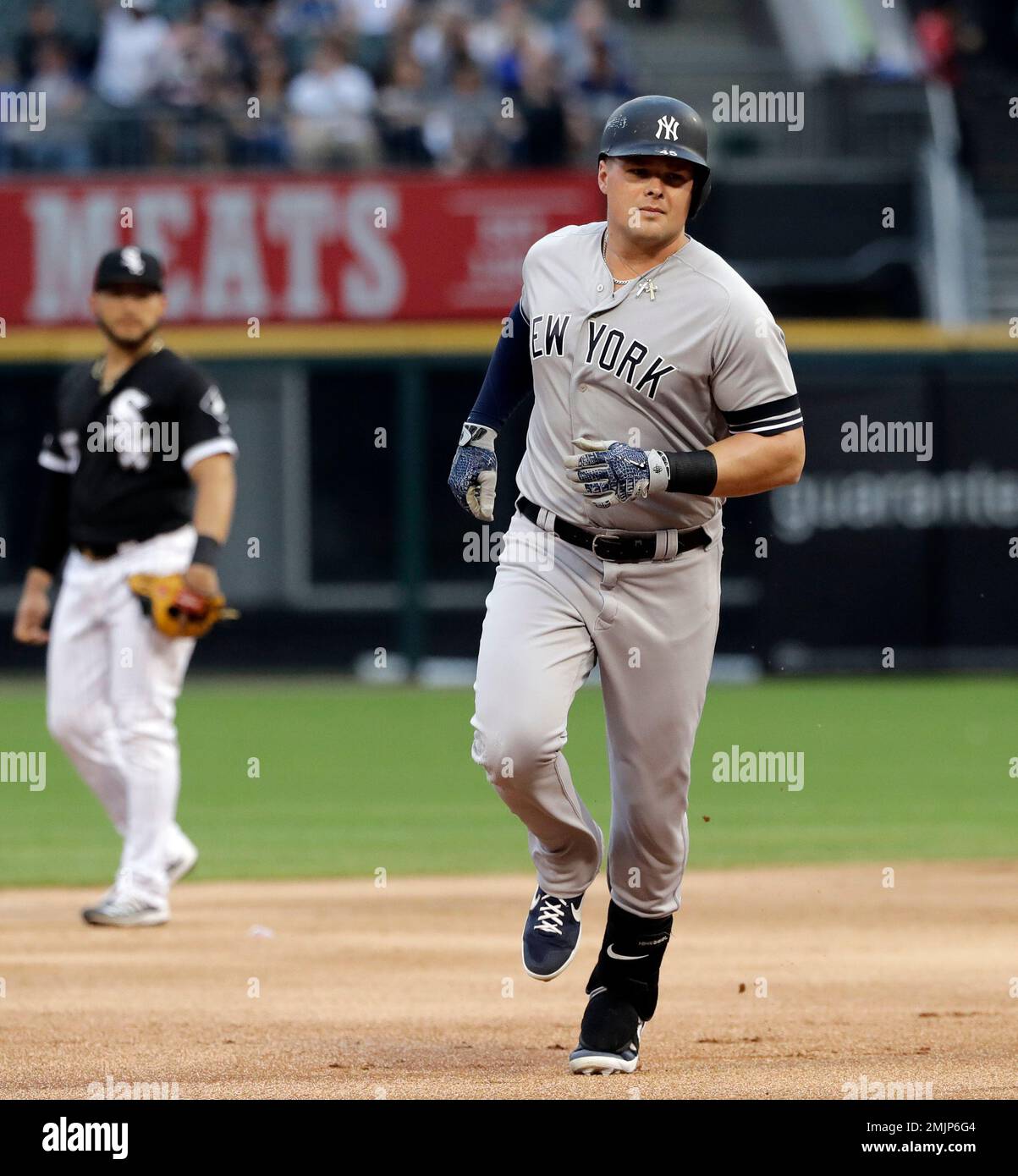 New York Yankees' Luke Voit rounds the bases after hitting a solo home ...