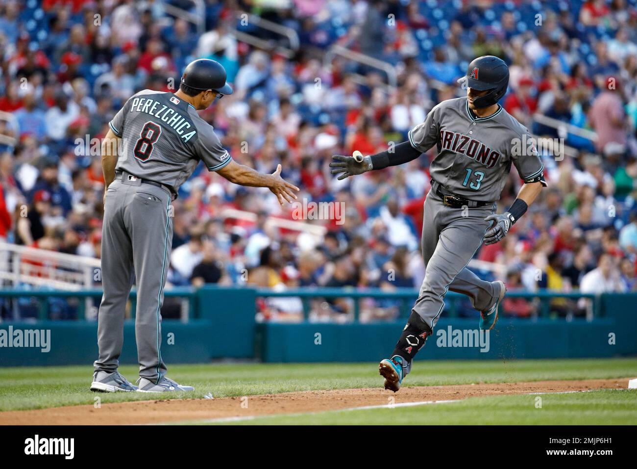 Arizona Diamondbacks' Nick Ahmed, right, rounds the bases past third ...