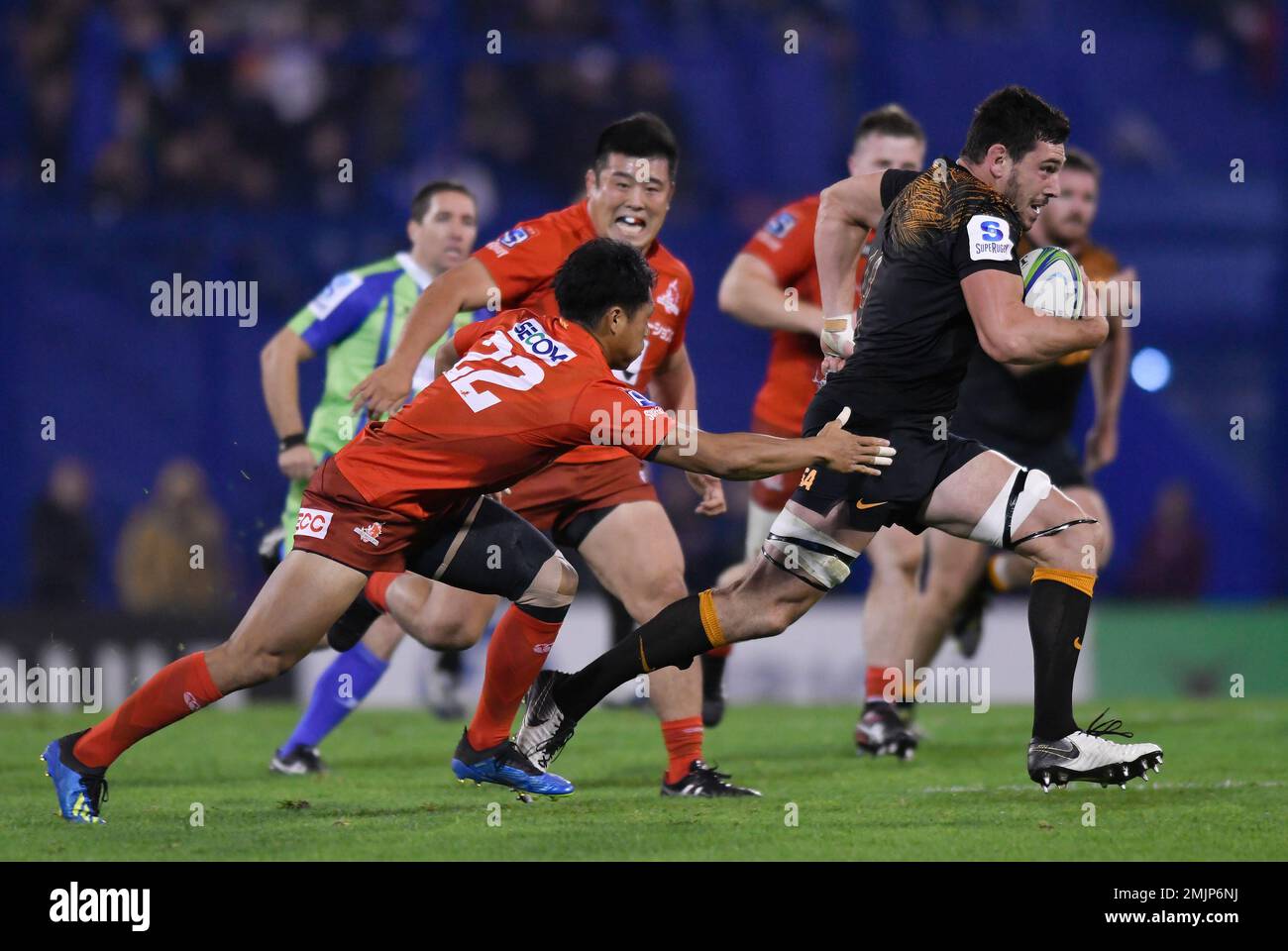 Guido Petti of Argentina's Jaguares, right, is tackled by Takuya ...