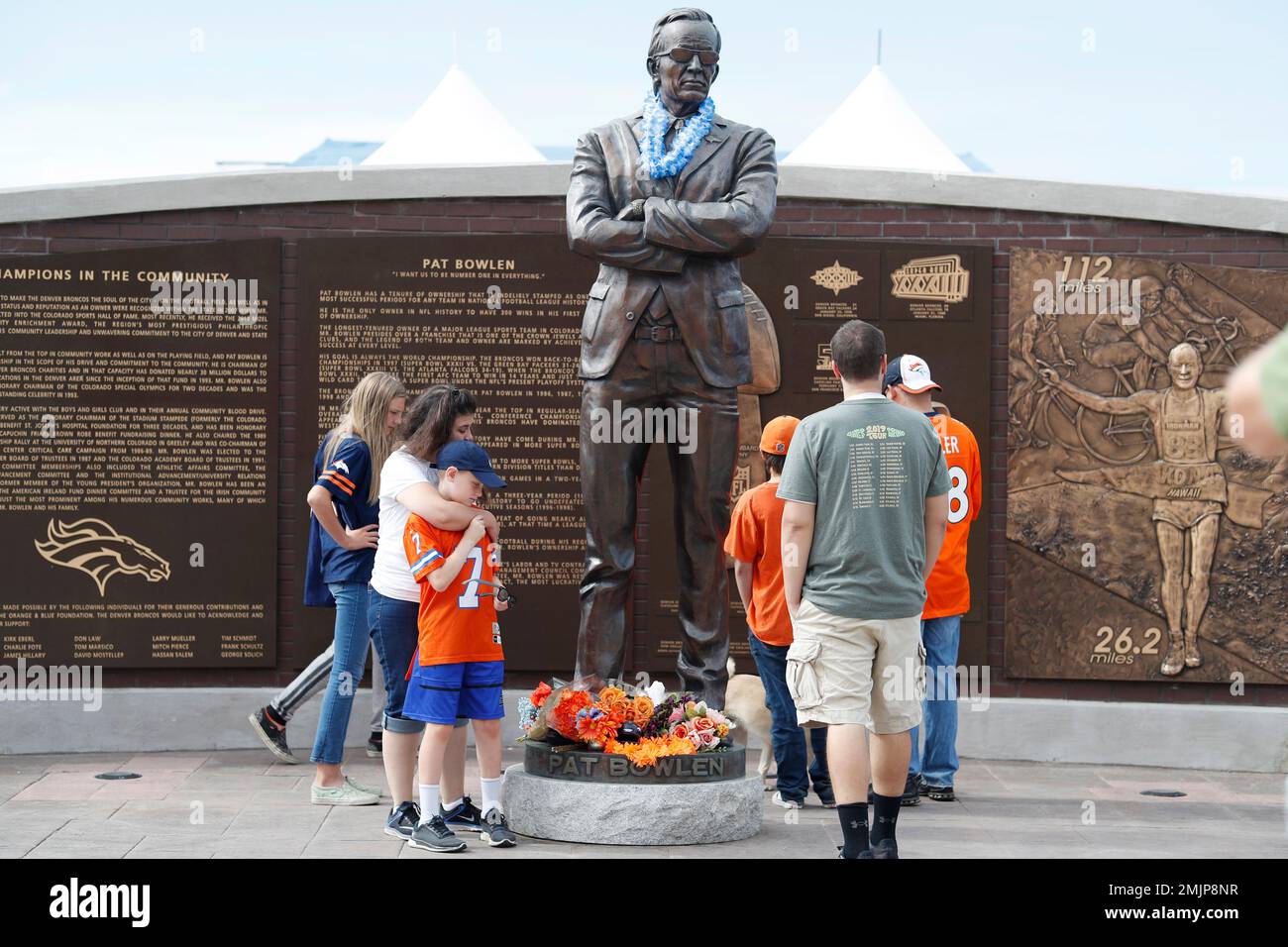 Fans gather at a statue of Denver Broncos owner Pat Bowlen outside Mile ...