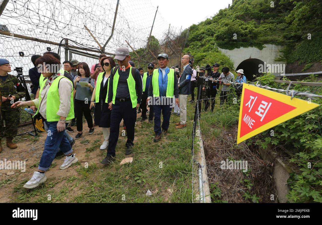 Hikers walk along the DMZ Peace Trail in the demilitarized zone in ...