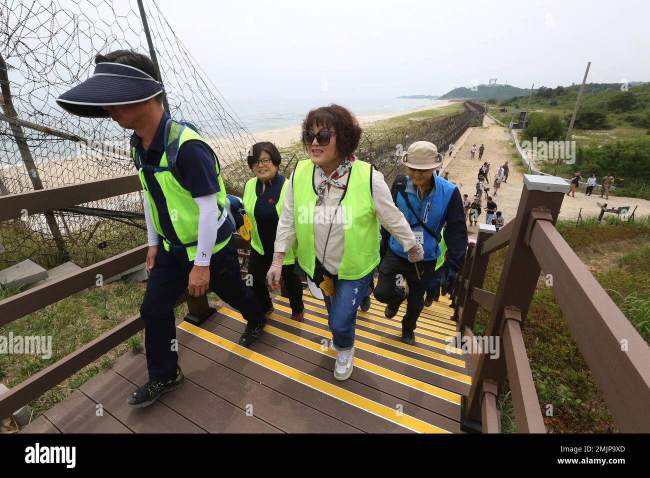 Hikers walk along the DMZ Peace Trail in the demilitarized zone in ...